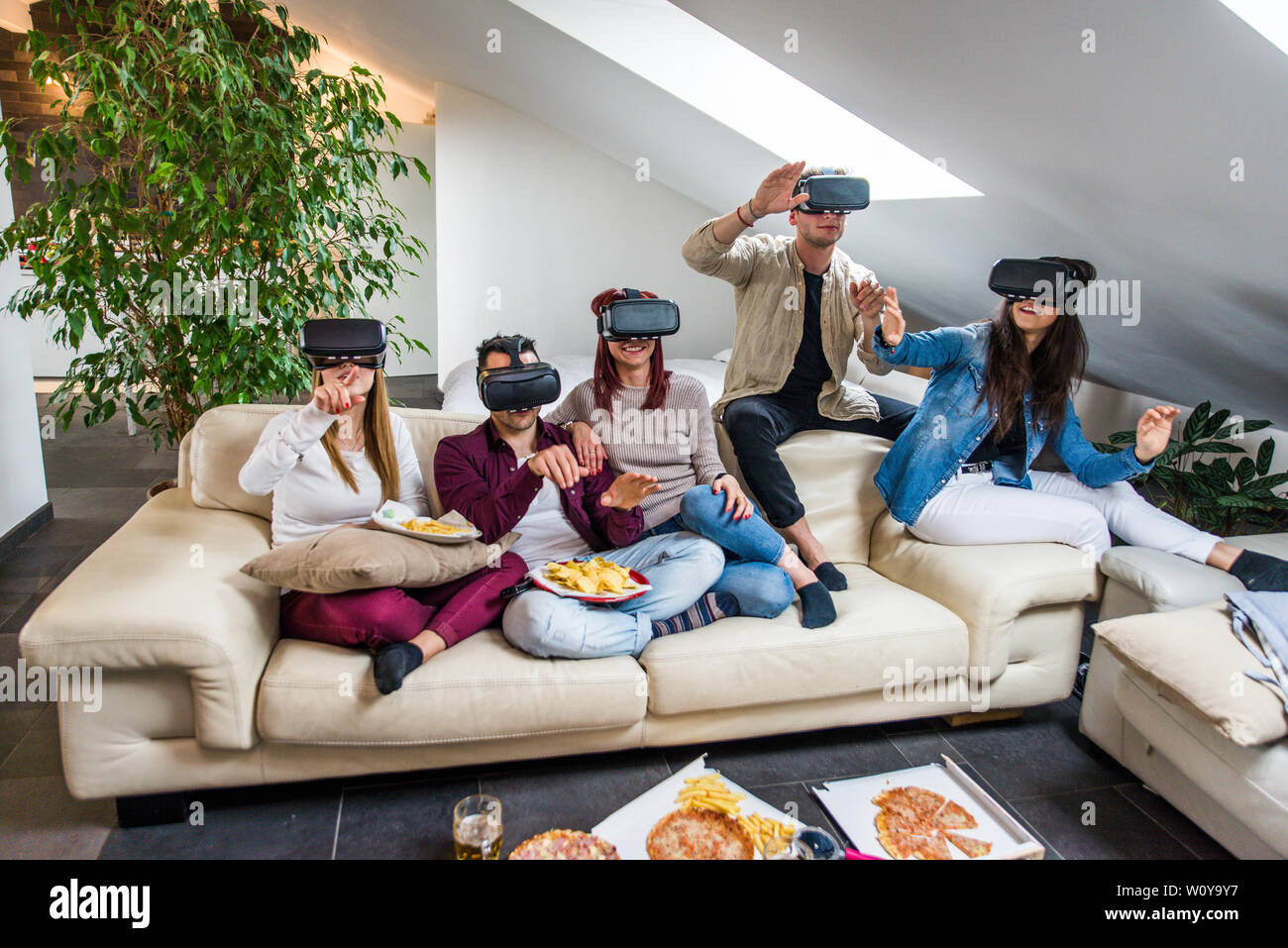Group of happy friends bonding at home - Young adults having party and ...