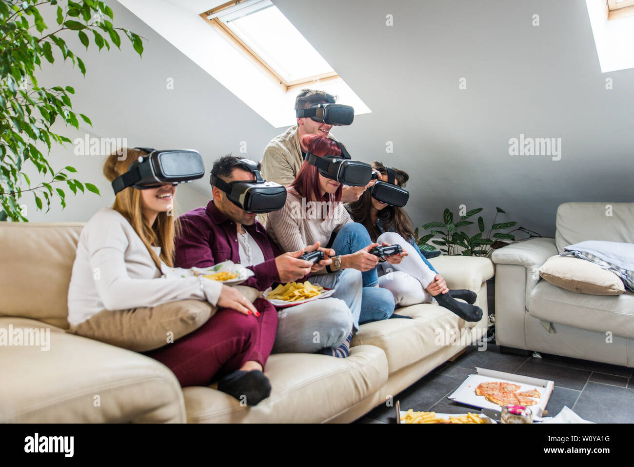 Group of happy friends bonding at home - Young adults having party and ...