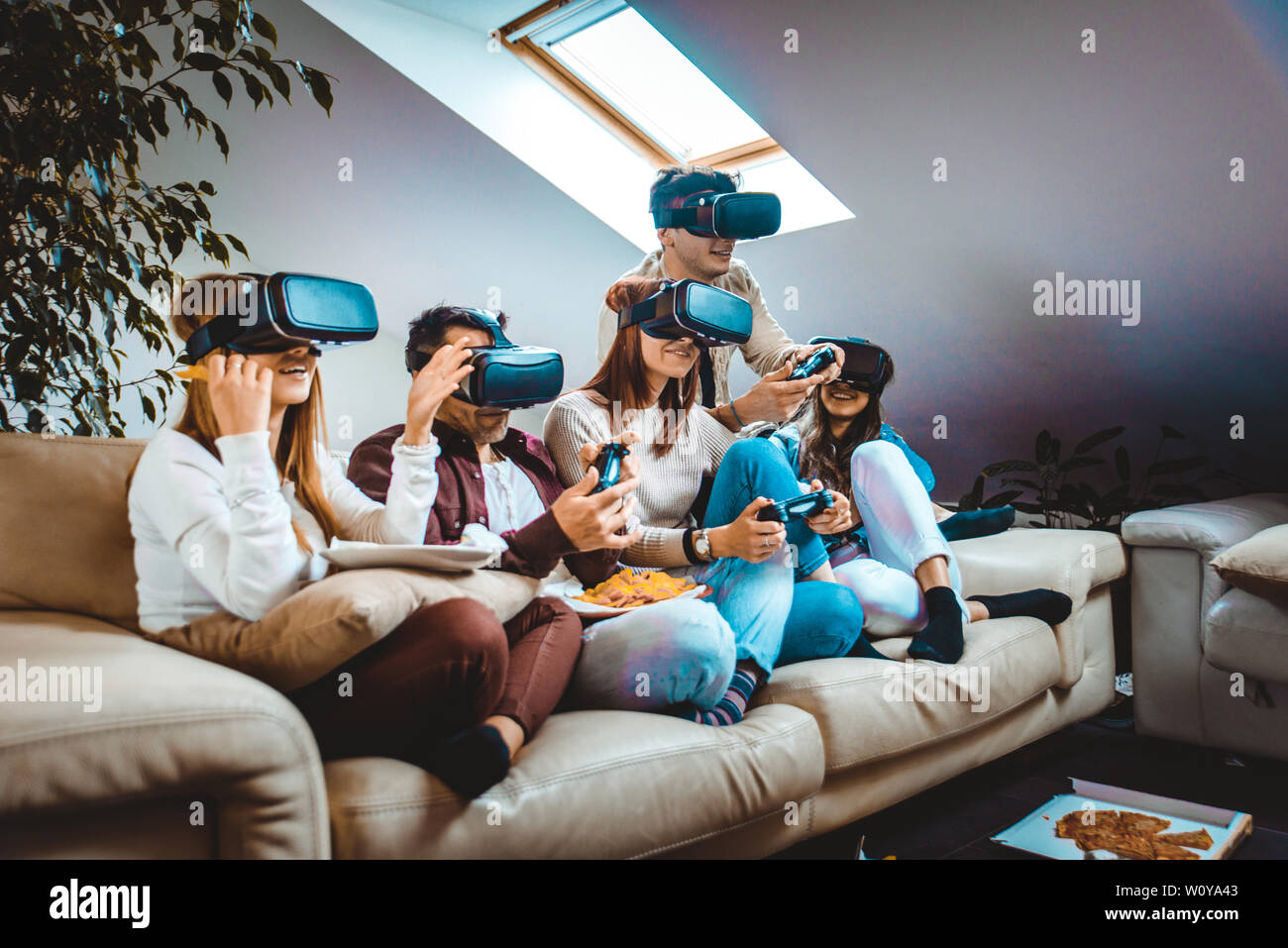 Group of happy friends bonding at home - Young adults having party and ...