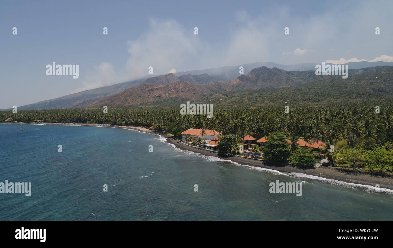 aerial seascape luxury hotel on beach background mountainss in tropical ...