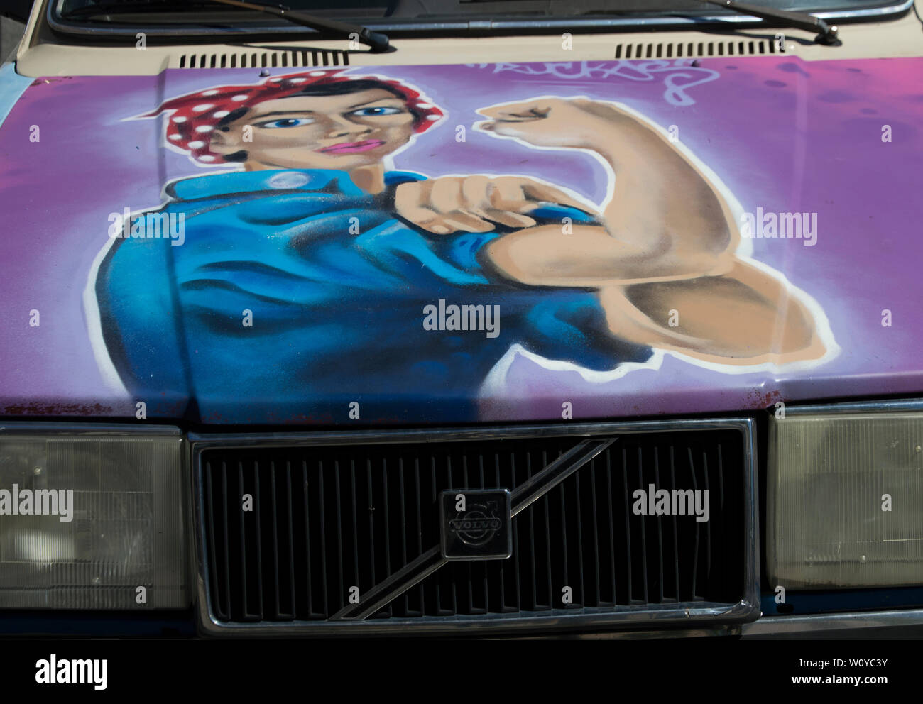We Can,painting of famous World War II poster on the hood of a car ...