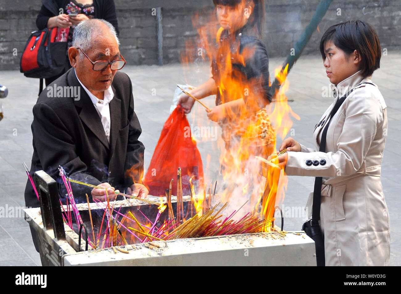 Worshippers burn incense offerings at Buddhist temple in Beijing Stock ...