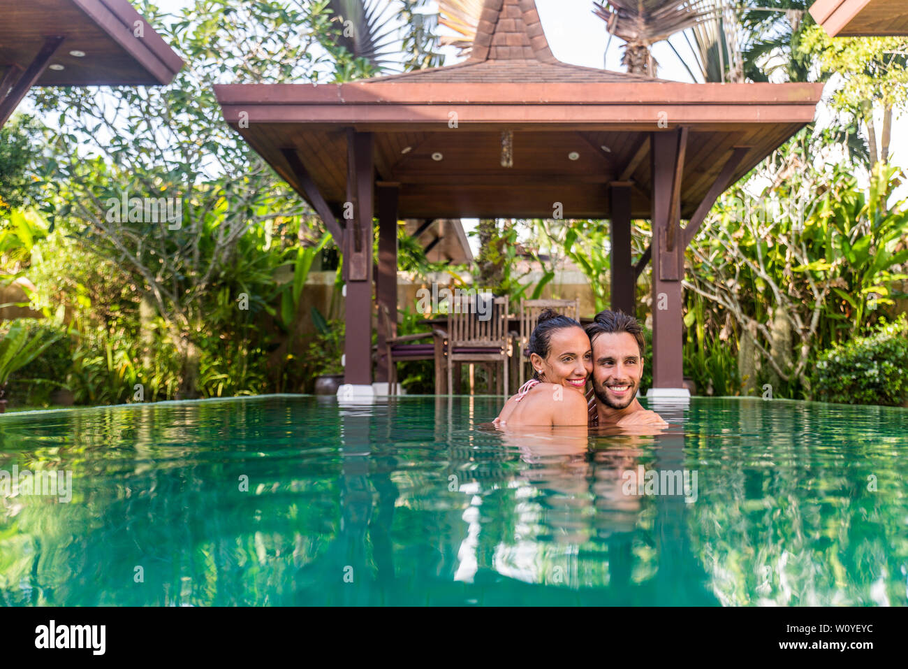 Couple playing on swimming pool hi-res stock photography and images - Alamy