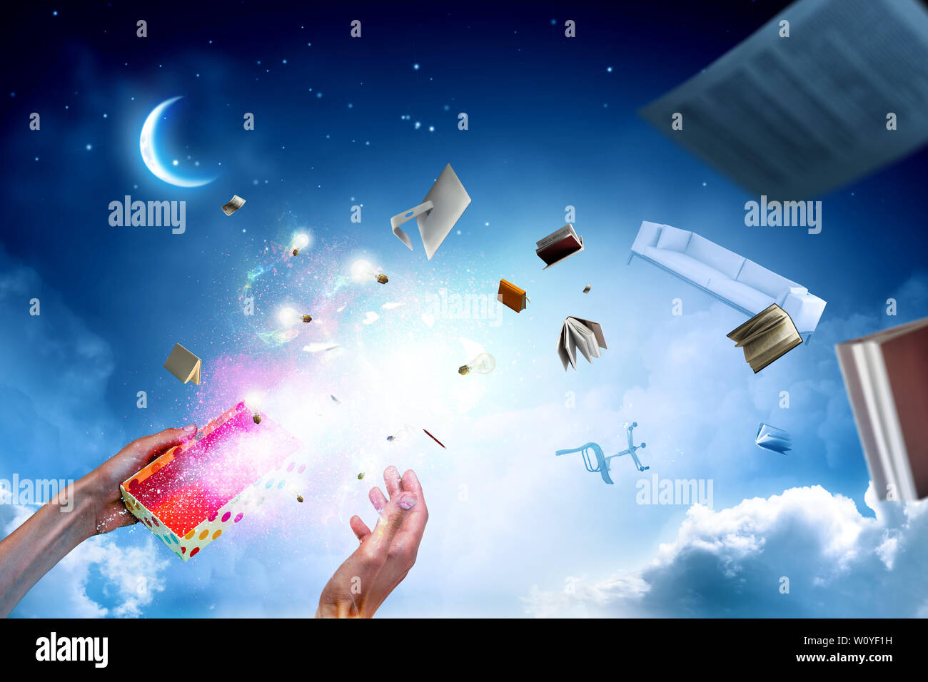 Man`s hands holding a small magic cardboard box, mixed media Stock ...