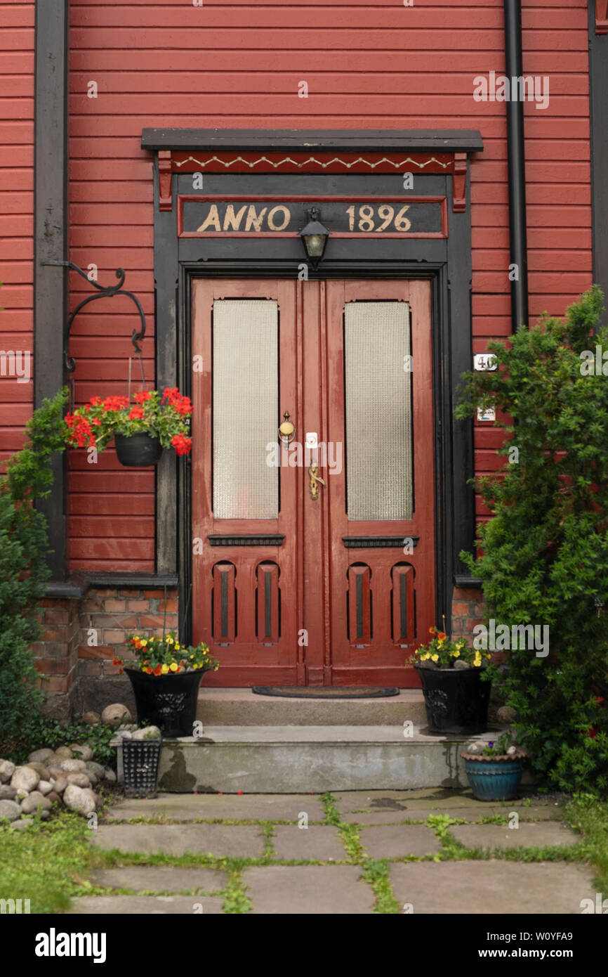 A historic wooden door dated 1896 on a traditional house in Oslo ...