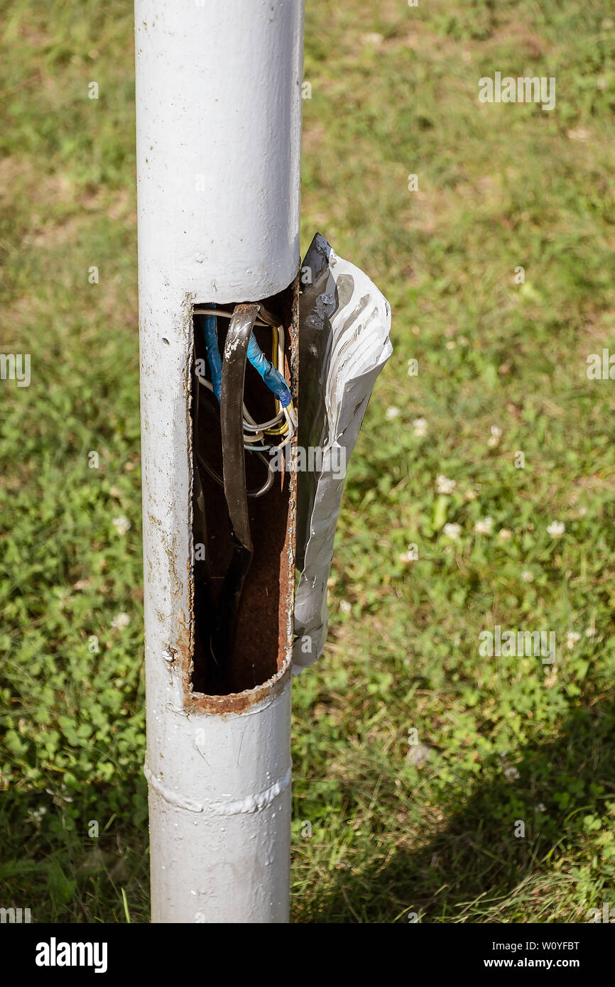 Copper wire thieves. Copper wires in street light pole, small plate ...
