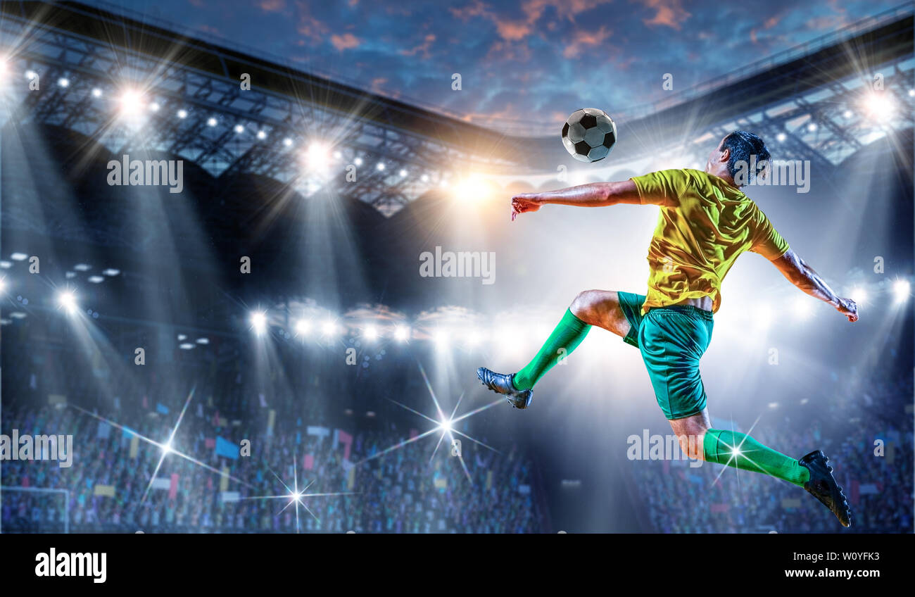 Football player on stadium. Mixed media Stock Photo - Alamy
