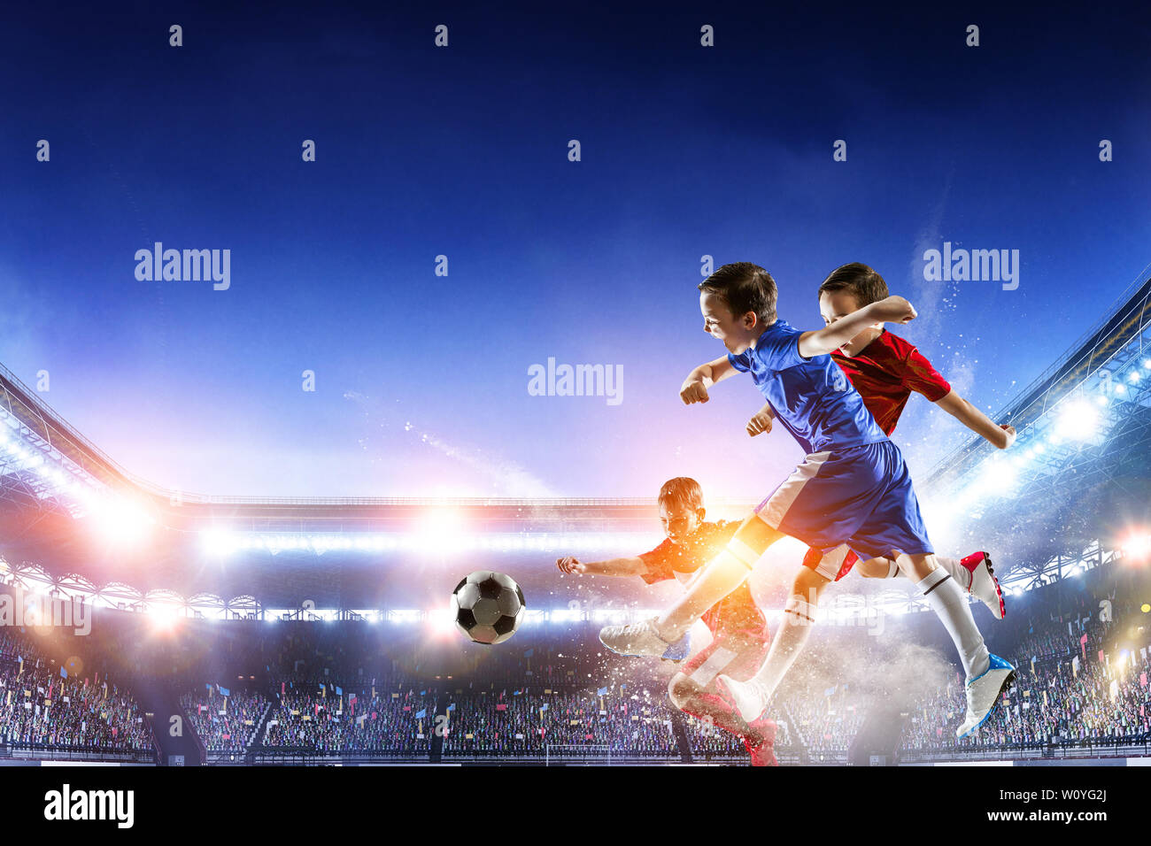 Kids on a soccer stadium. Mixed media Stock Photo - Alamy