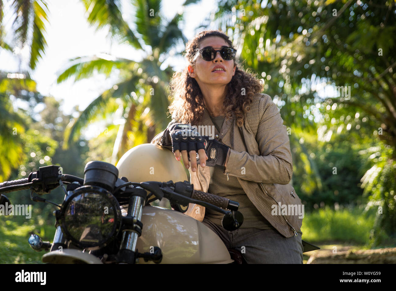 Beautiful female biker driving a cafe' racer motorbike - Pretty girl ...