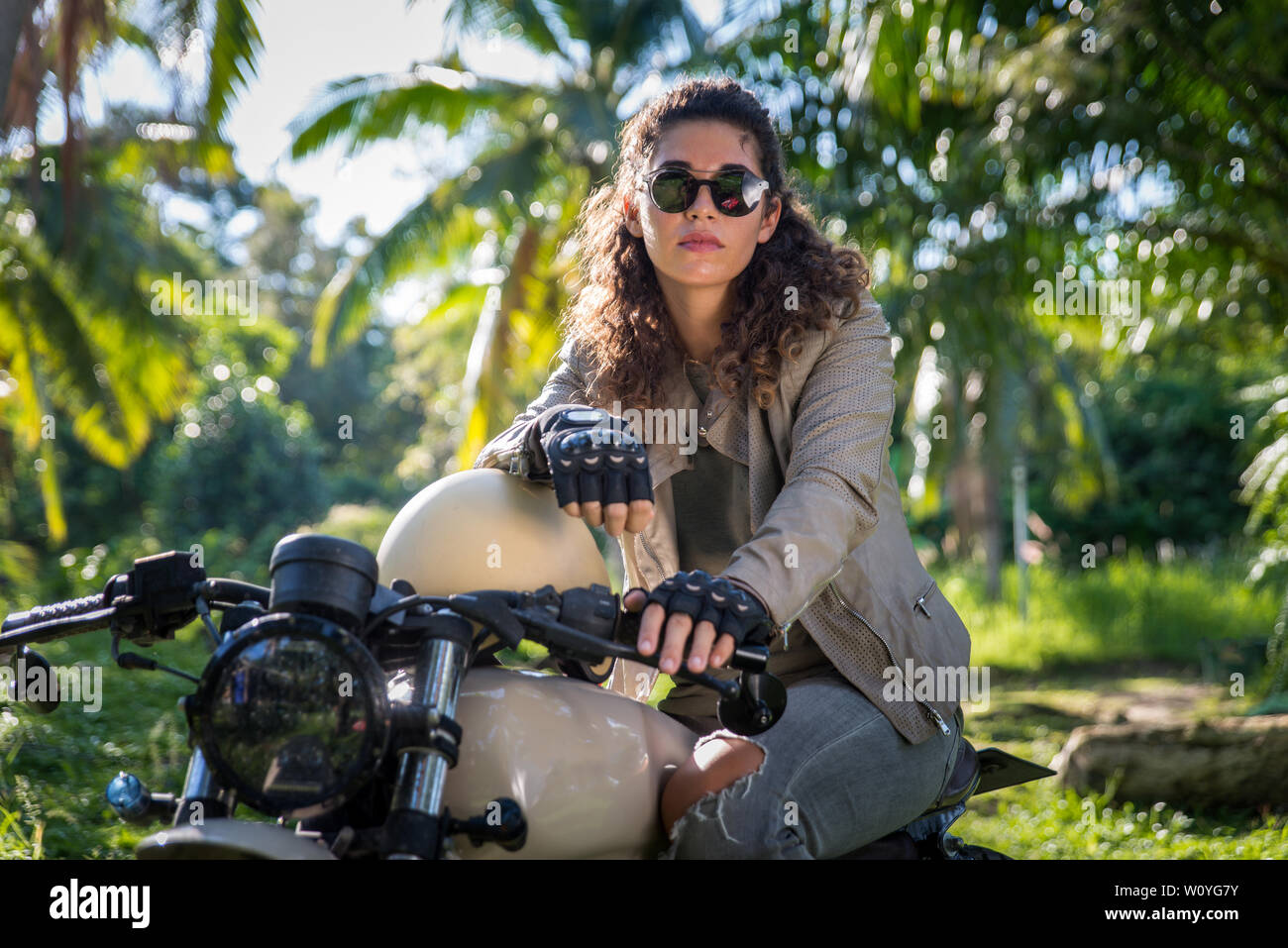Beautiful female biker driving a cafe' racer motorbike - Pretty girl ...
