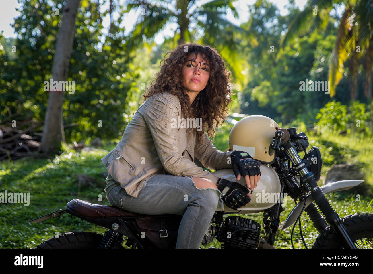 Beautiful female biker driving a cafe' racer motorbike - Pretty girl ...