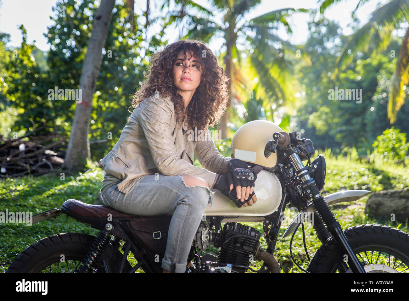 Beautiful female biker driving a cafe' racer motorbike - Pretty girl ...