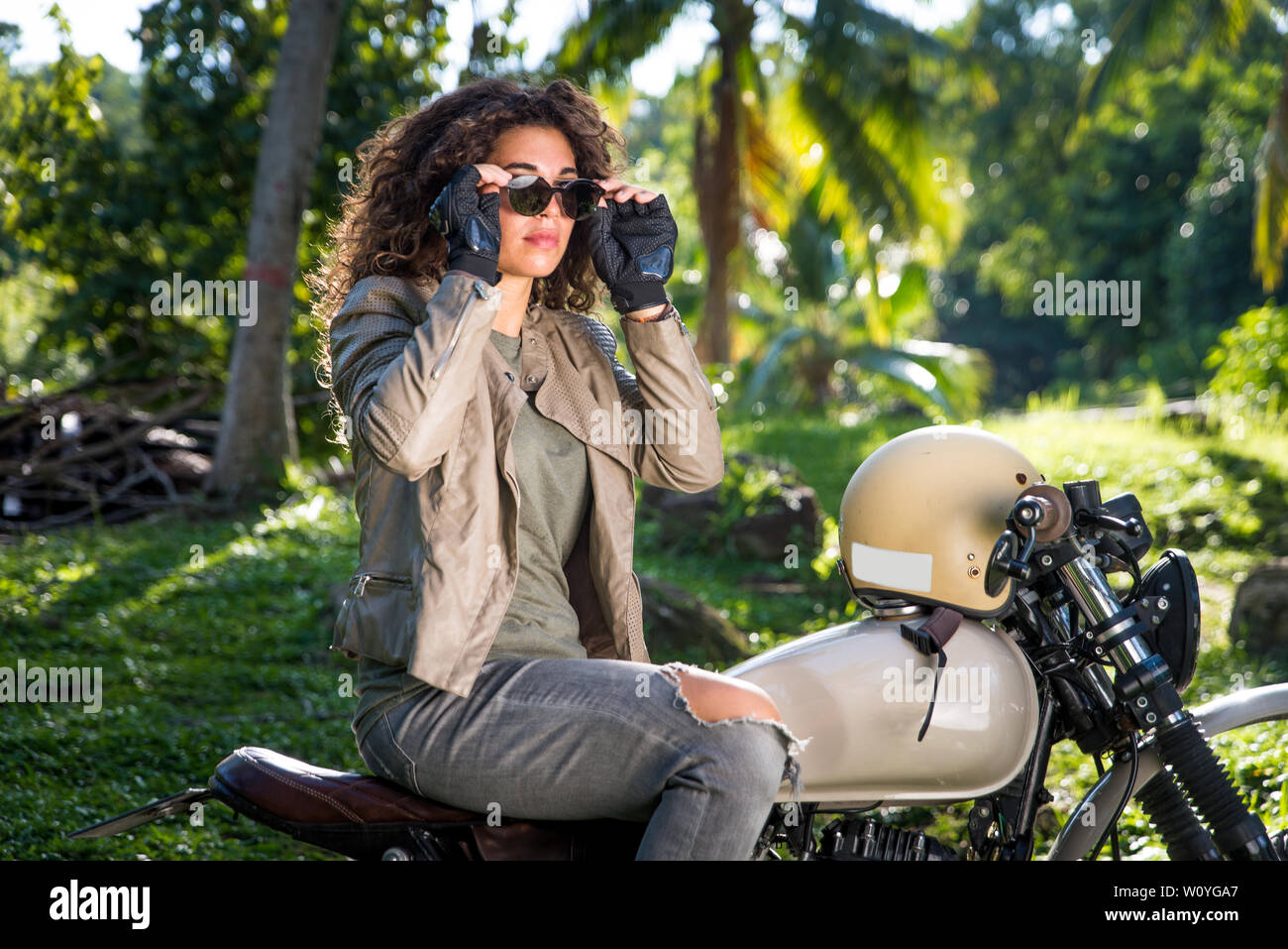 Beautiful female biker driving a cafe' racer motorbike - Pretty girl ...
