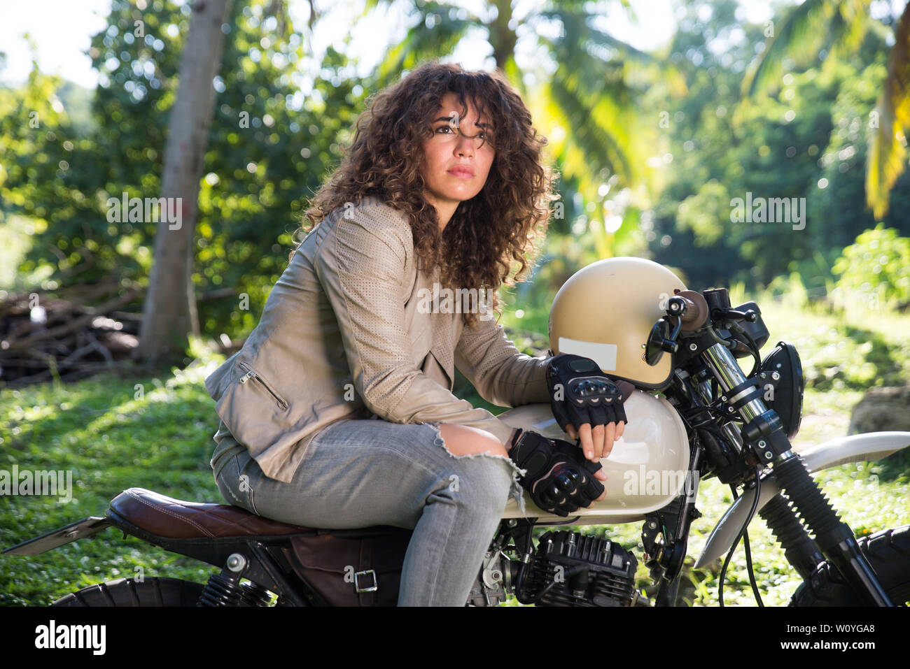 Beautiful female biker driving a cafe' racer motorbike - Pretty girl ...