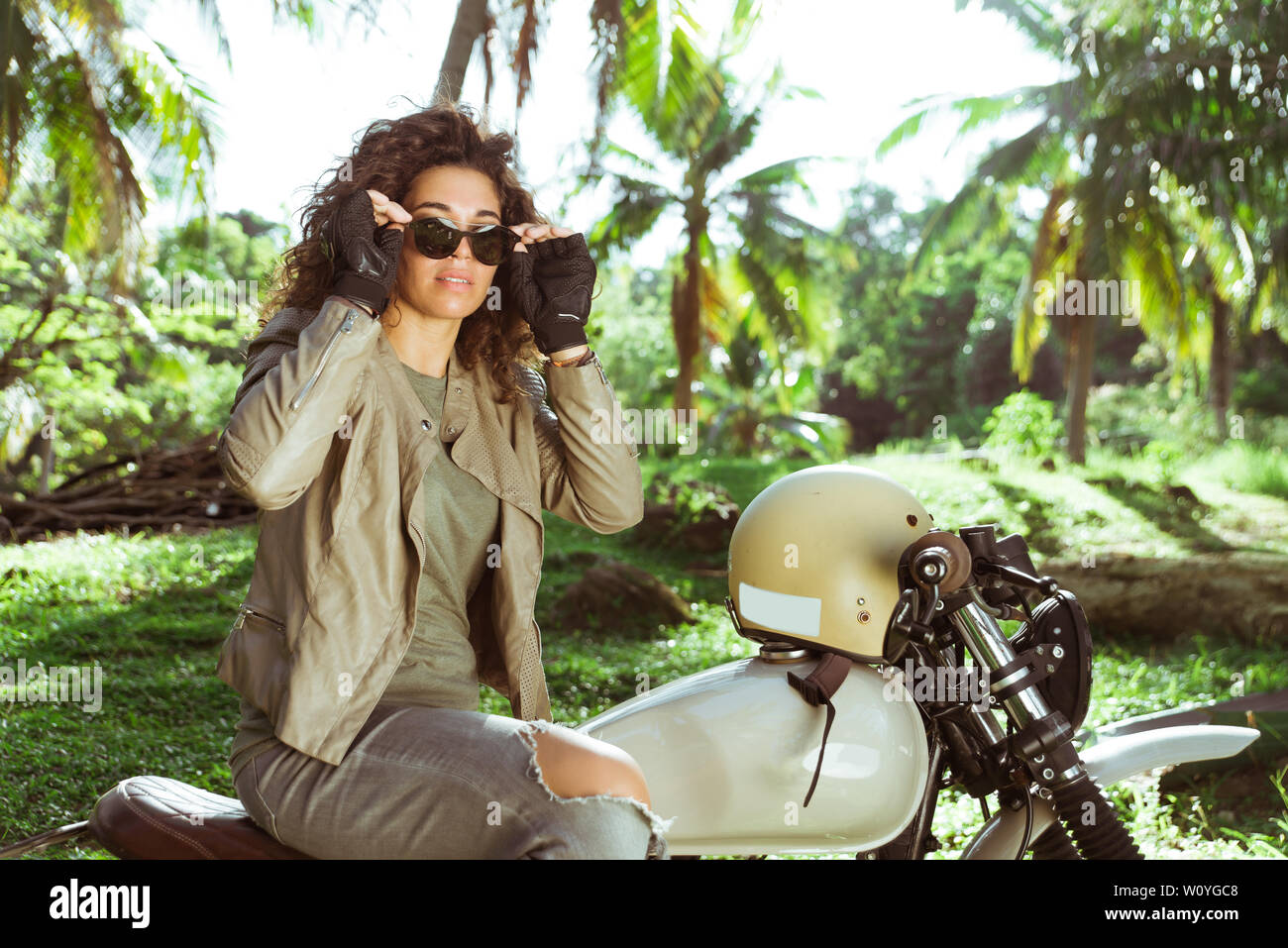 Beautiful female biker driving a cafe' racer motorbike - Pretty girl ...