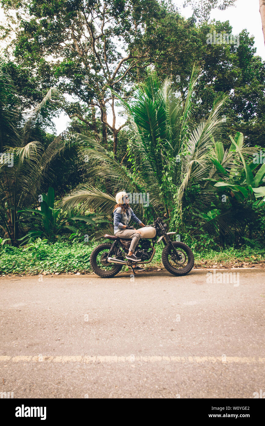 Beautiful female biker driving a cafe' racer motorbike - Pretty girl ...