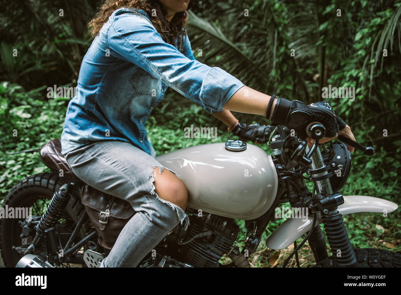 Beautiful female biker driving a cafe' racer motorbike - Pretty girl ...