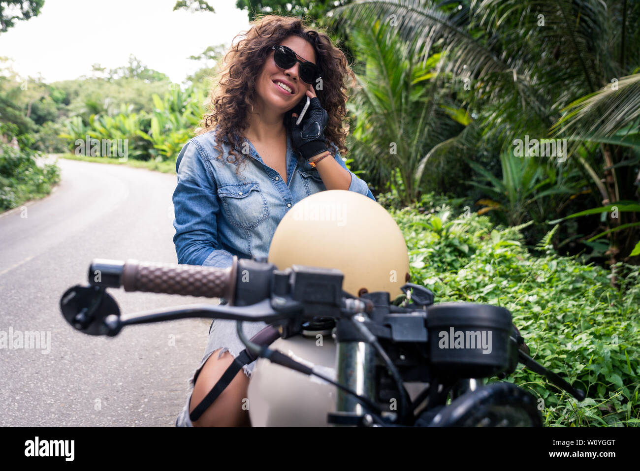Beautiful female biker driving a cafe' racer motorbike - Pretty girl ...