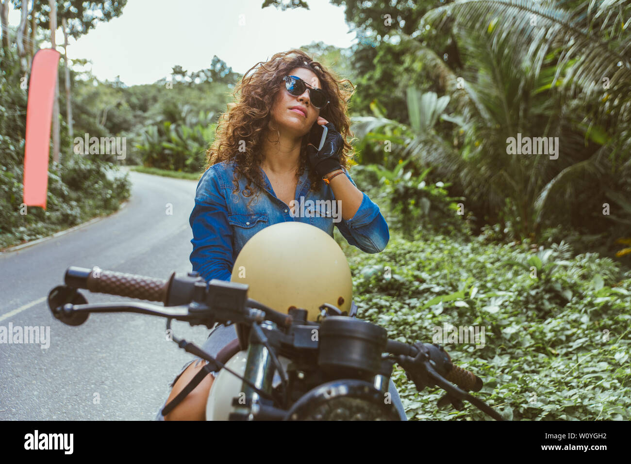Beautiful female biker driving a cafe' racer motorbike - Pretty girl ...