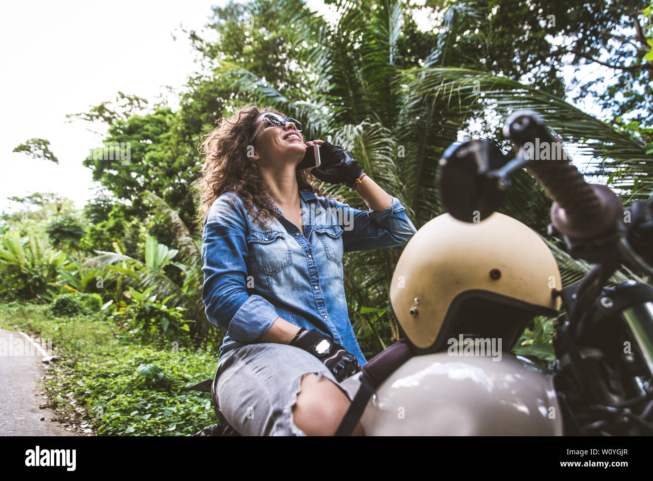 Beautiful female biker driving a cafe' racer motorbike - Pretty girl ...