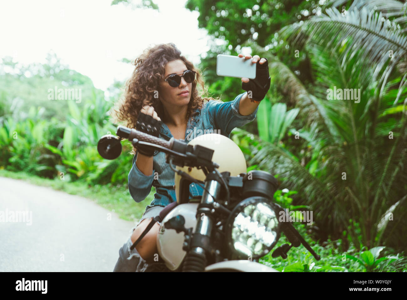 Beautiful female biker driving a cafe' racer motorbike - Pretty girl ...