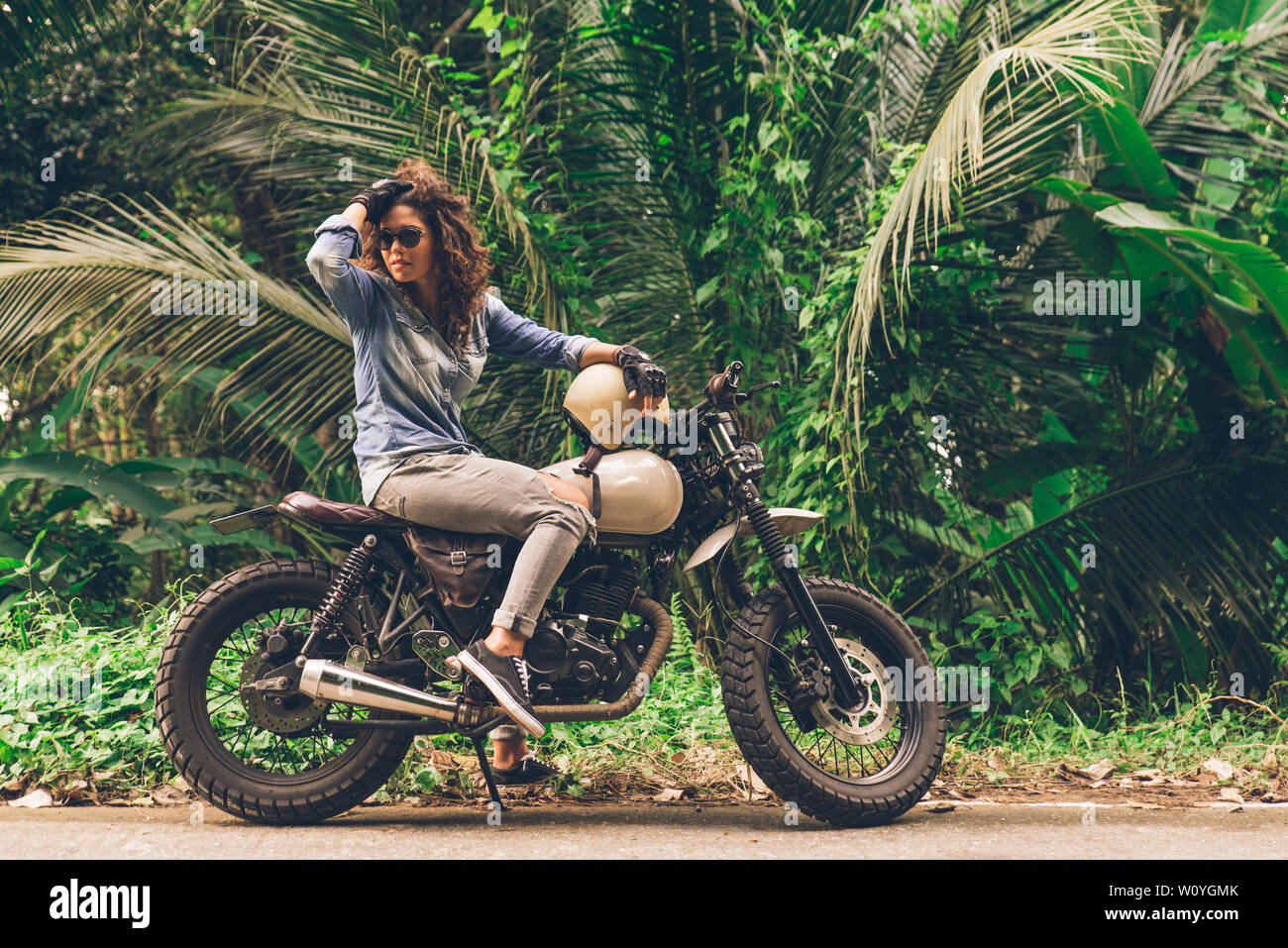 Beautiful female biker driving a cafe' racer motorbike - Pretty girl ...