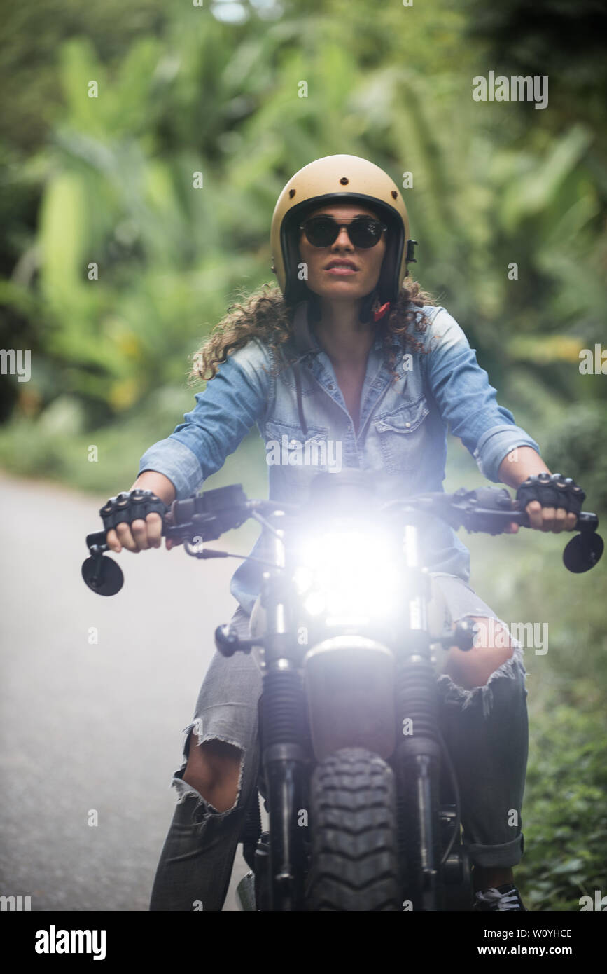 Beautiful female biker driving a cafe' racer motorbike - Pretty girl ...