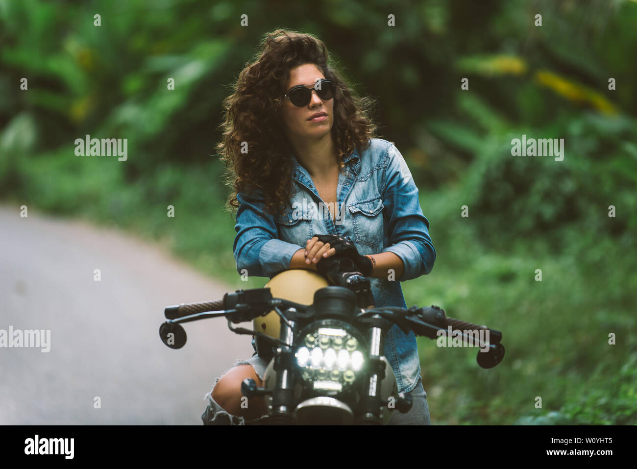 Beautiful female biker driving a cafe' racer motorbike - Pretty girl ...