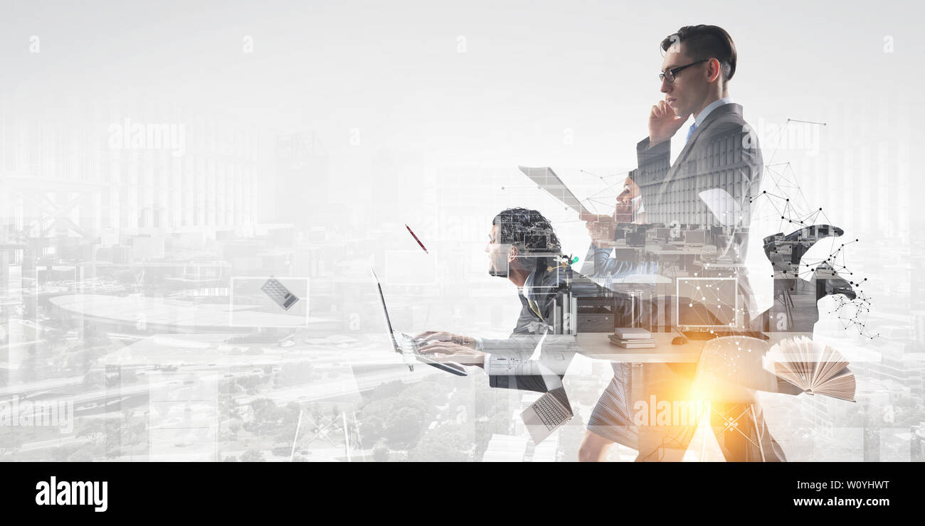 Young businessmen at work, city view background Stock Photo - Alamy