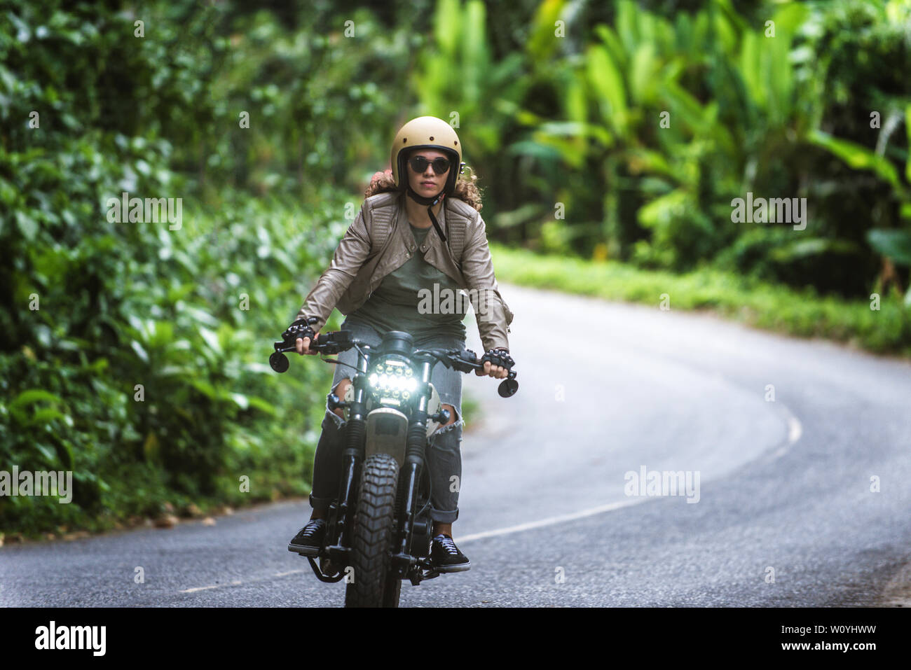 Beautiful female biker driving a cafe' racer motorbike - Pretty girl ...
