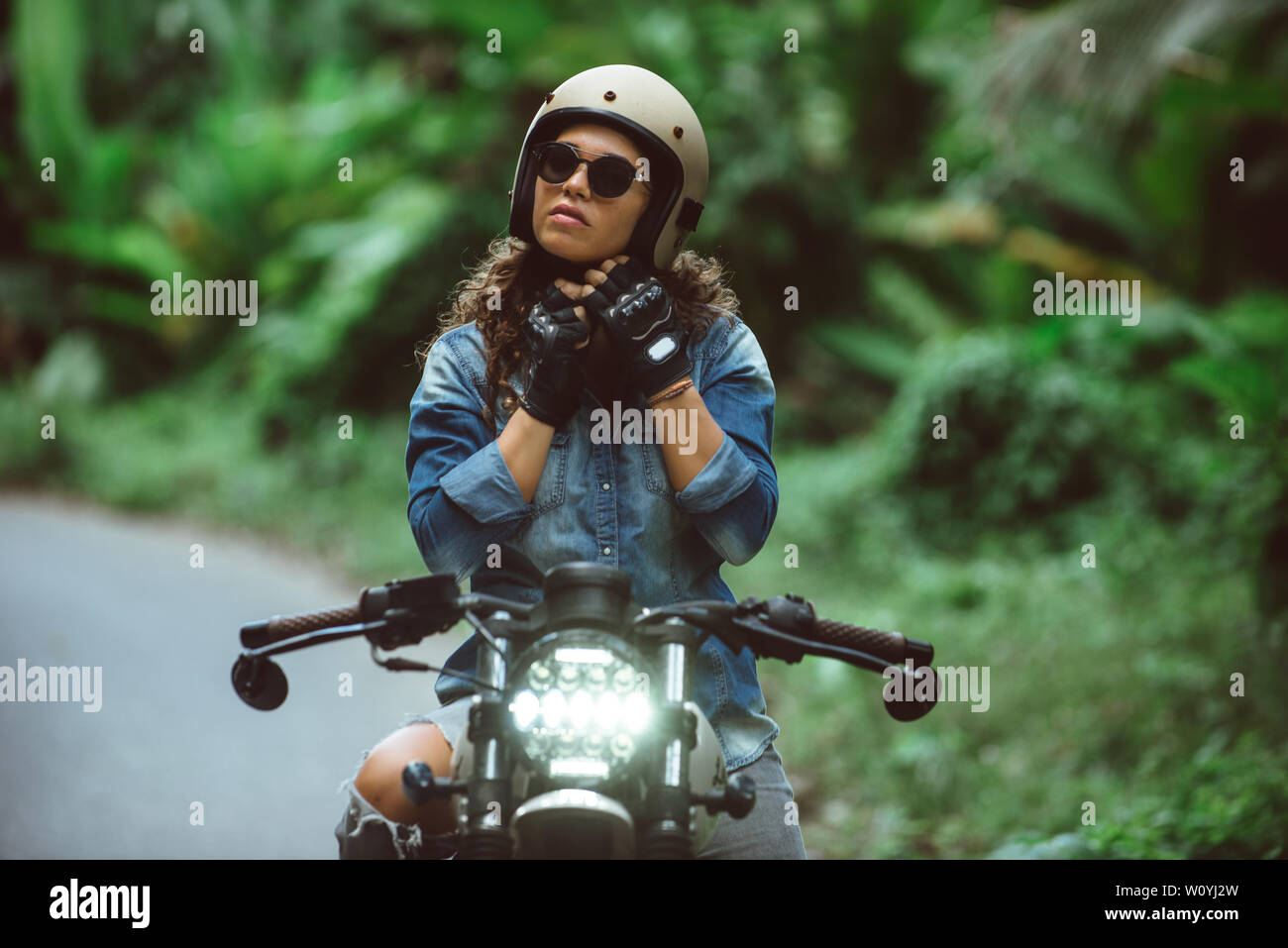 Beautiful female biker driving a cafe' racer motorbike - Pretty girl ...