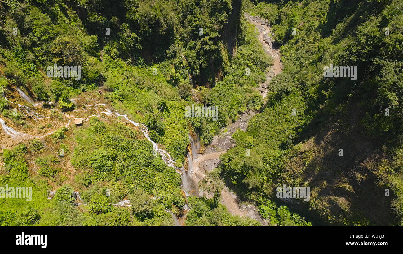 beautiful waterfall Coban Sewu in tropical forest, Java Indonesia ...