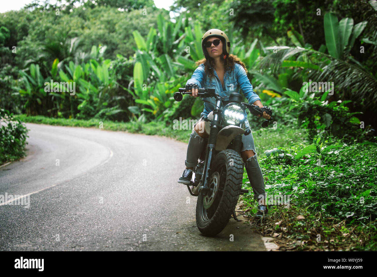 Beautiful female biker driving a cafe' racer motorbike - Pretty girl ...