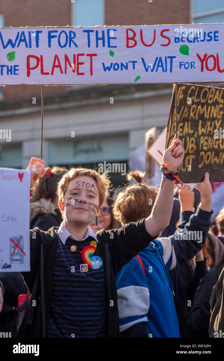 Boy with his placard at a Children's climate change protest march UK ...