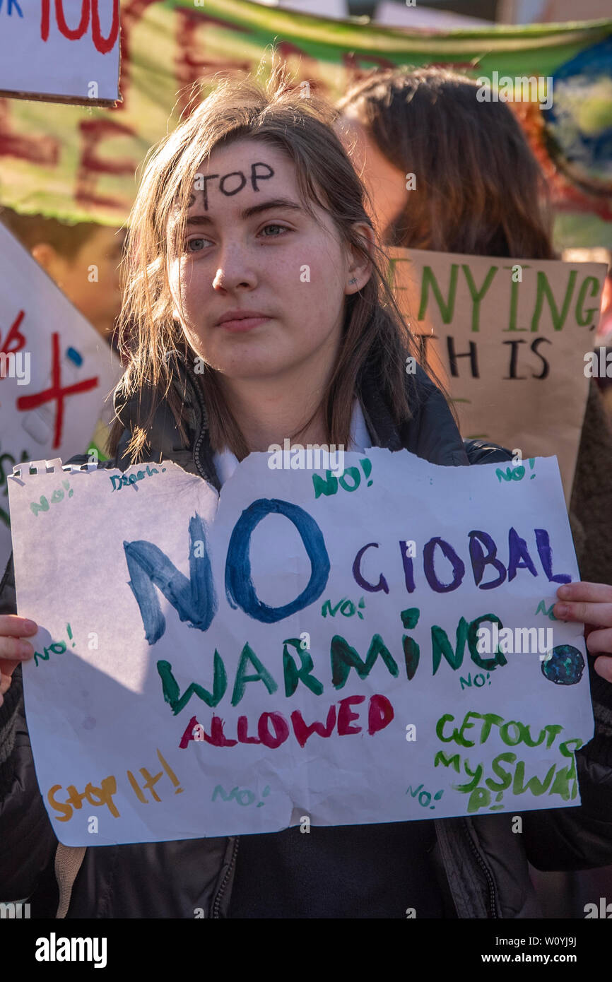 girl protestor with placard at a Children's climate change march UK ...