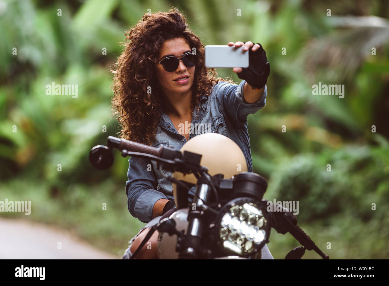 Beautiful female biker driving a cafe' racer motorbike - Pretty girl ...