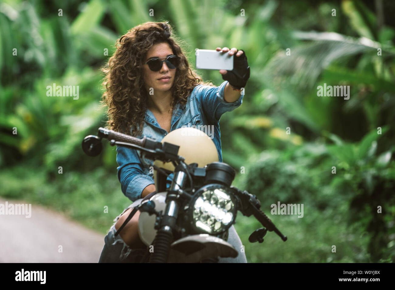Beautiful female biker driving a cafe' racer motorbike - Pretty girl ...