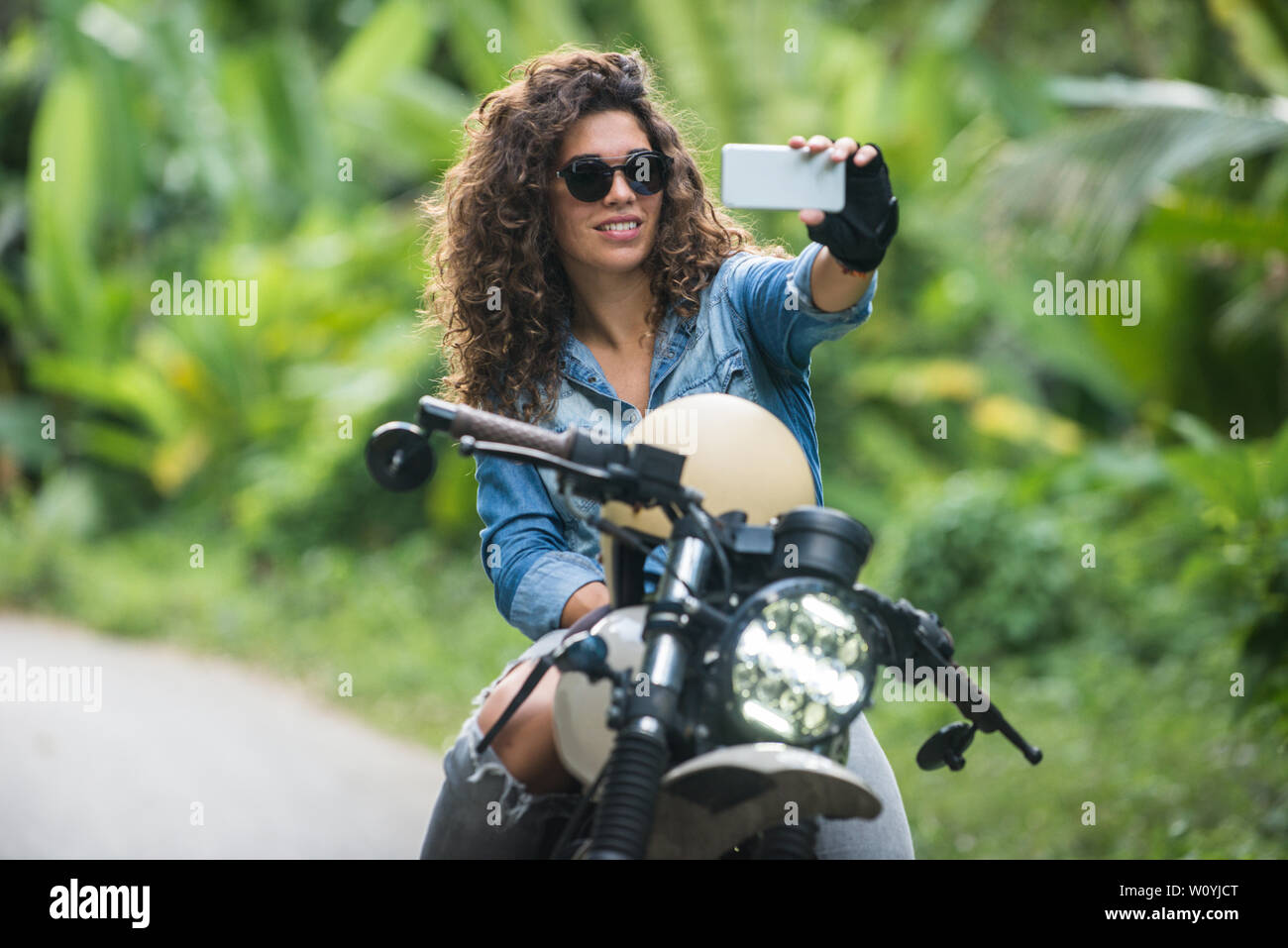 Beautiful female biker driving a cafe' racer motorbike - Pretty girl ...