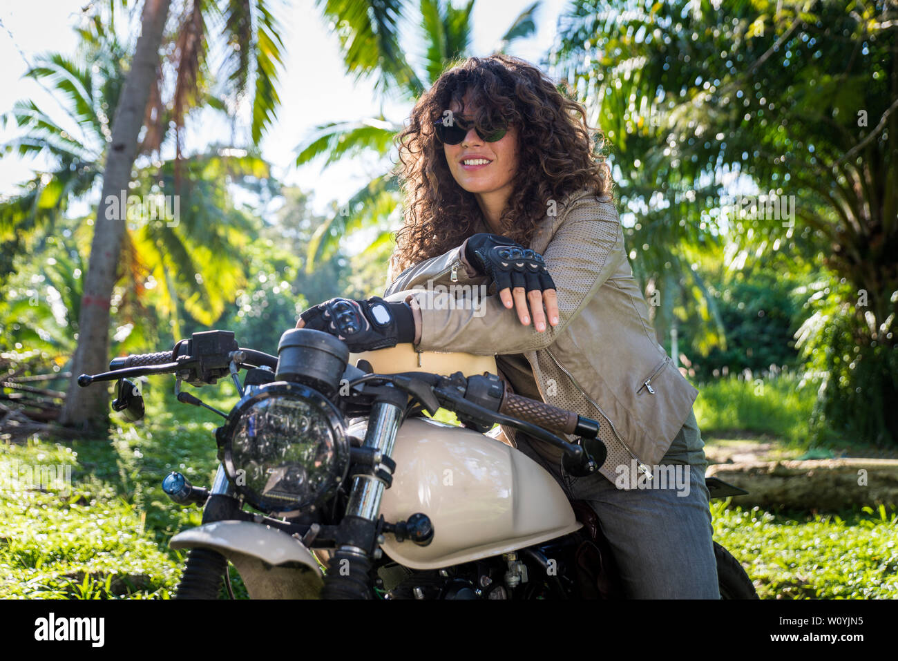 Beautiful female biker driving a cafe' racer motorbike - Pretty girl ...