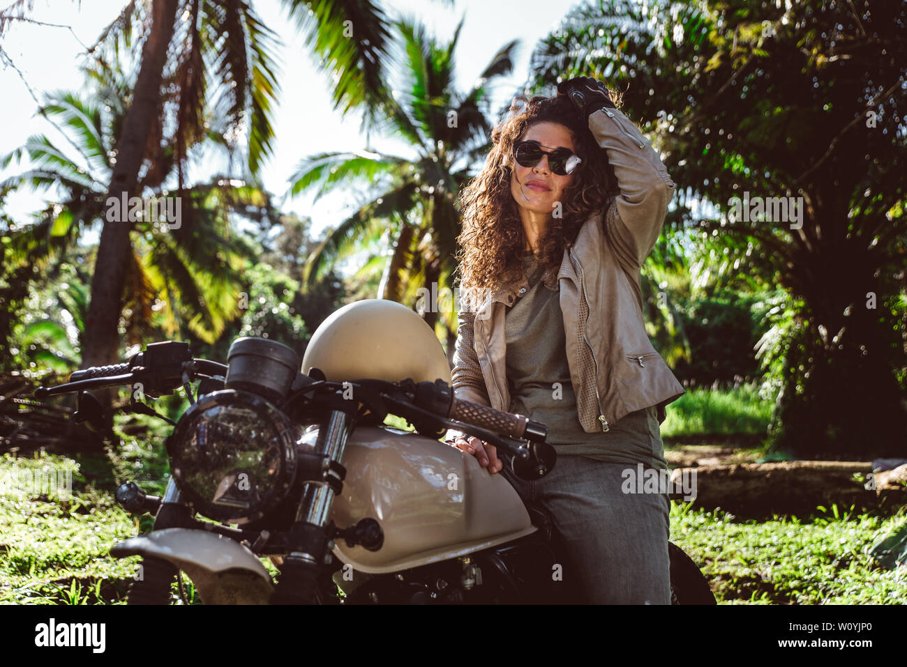 Beautiful female biker driving a cafe' racer motorbike - Pretty girl ...