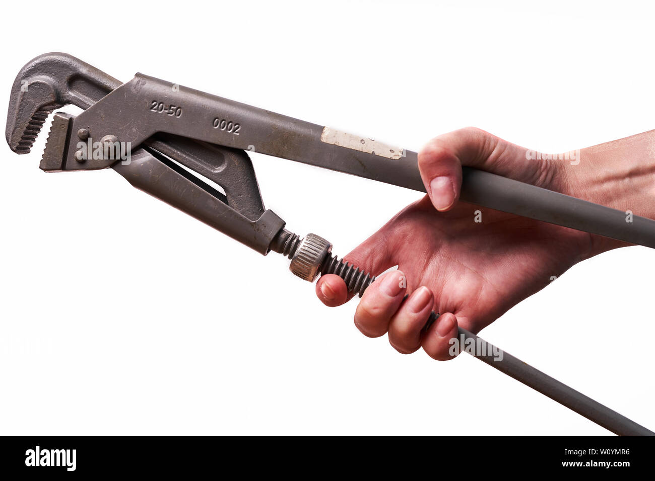 Girl holding a plumbing key isolated on a white background Stock Photo ...