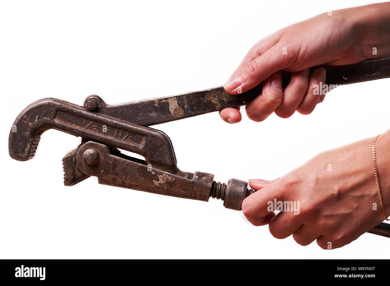Girl holding a plumbing key isolated on a white background Stock Photo ...