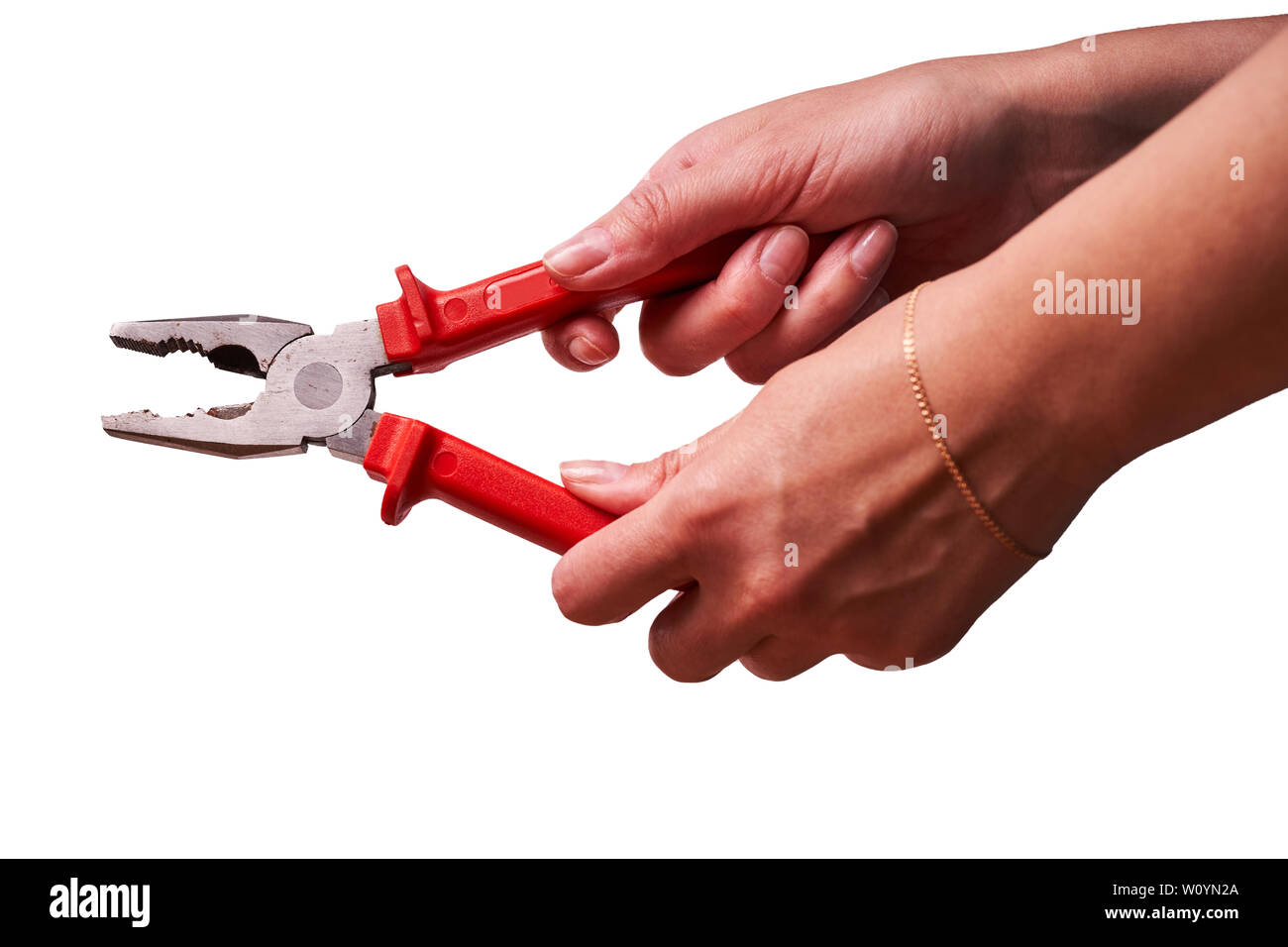 Girl holding a pair of pliers with red handles isolated on white ...