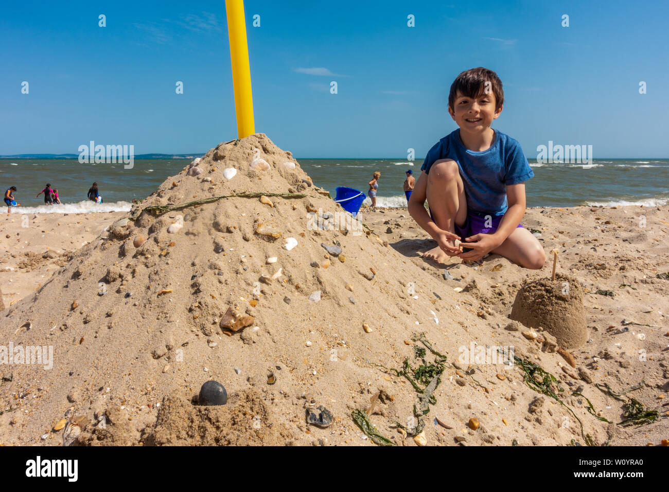 Boys building sand castle hi-res stock photography and images - Alamy