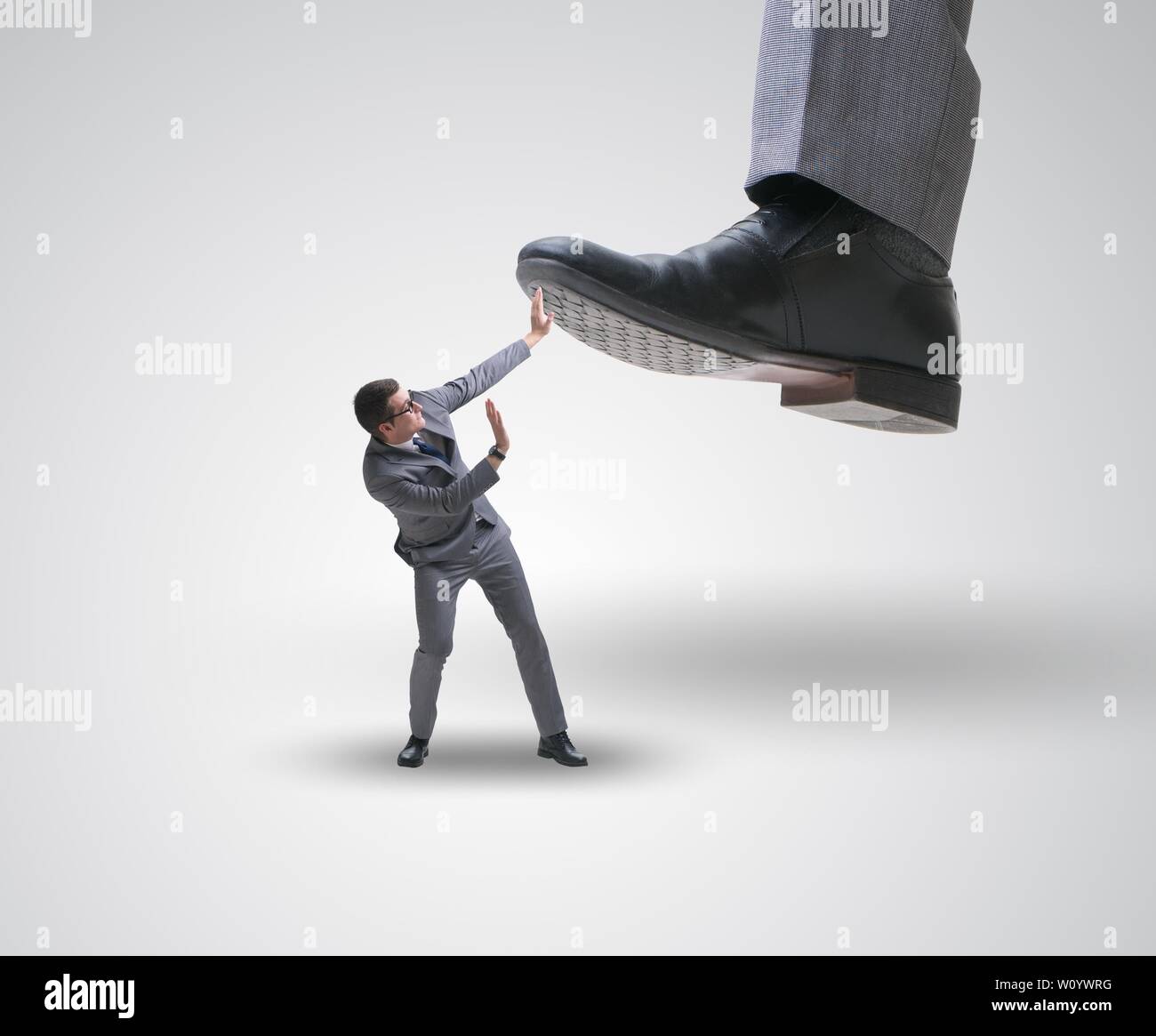 Bad angry boss stamping on employee in business concept Stock Photo - Alamy