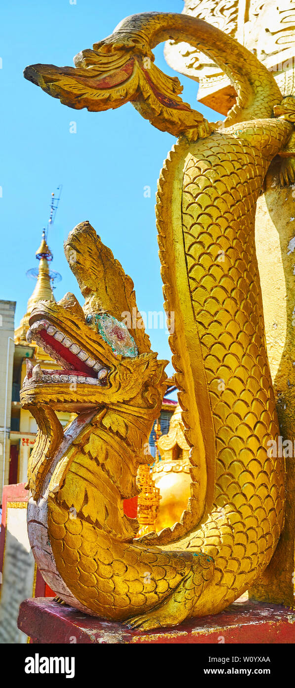 The statue of the Nagar (Nayar) golden dragon-serpent guards the pagoda ...
