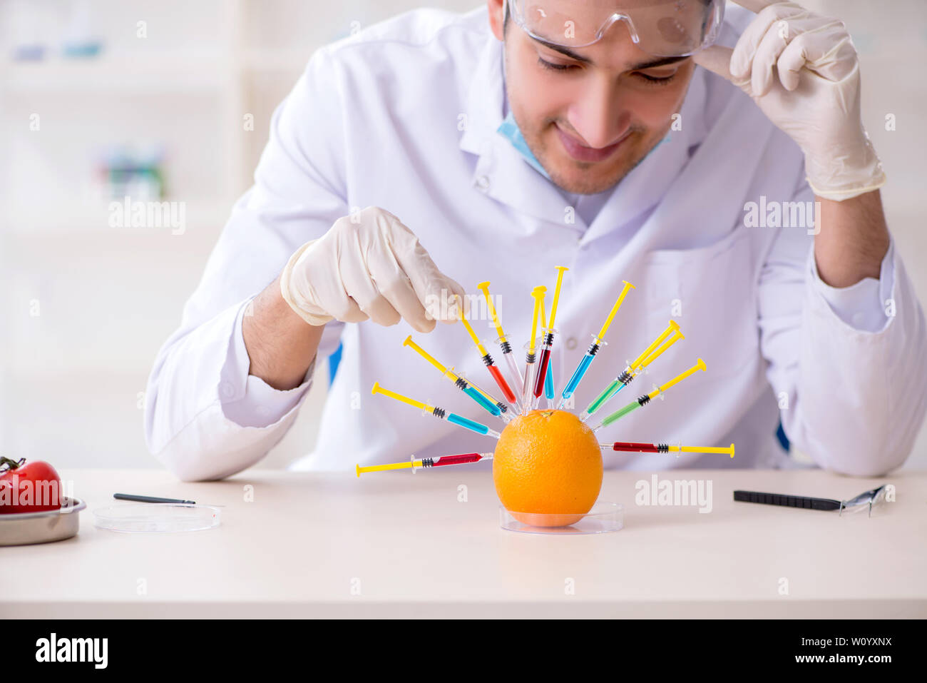 Male nutrition expert testing food products in lab Stock Photo - Alamy