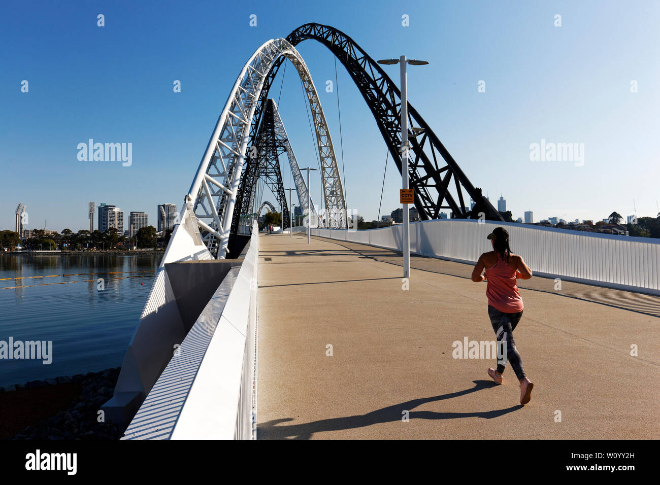 Woman running on Matagarup Bridge , Perth, Western Australia Stock ...