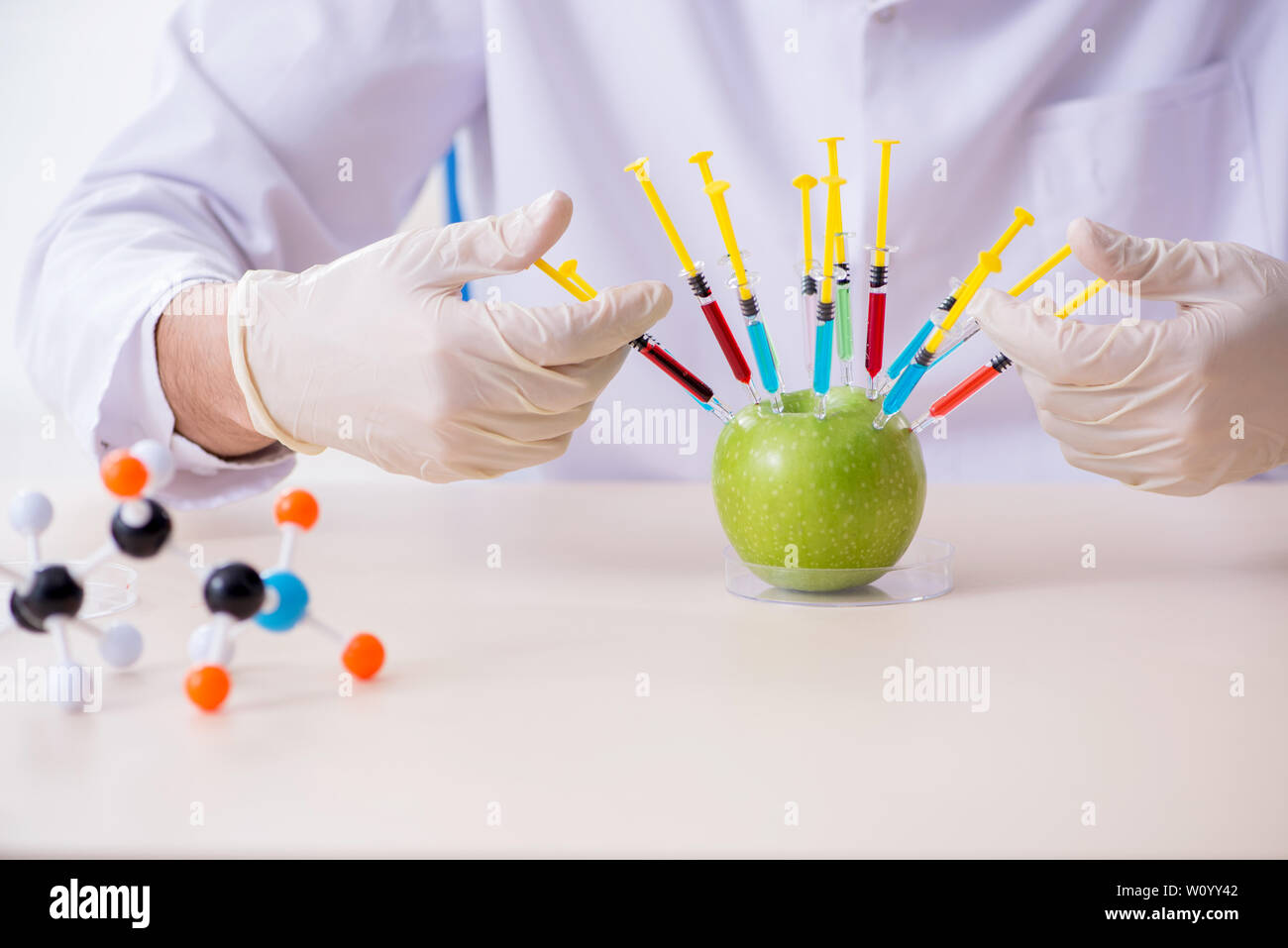 Male nutrition expert testing food products in lab Stock Photo - Alamy