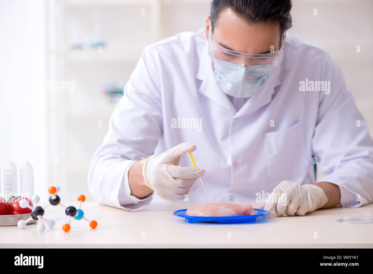 Male nutrition expert testing food products in lab Stock Photo - Alamy